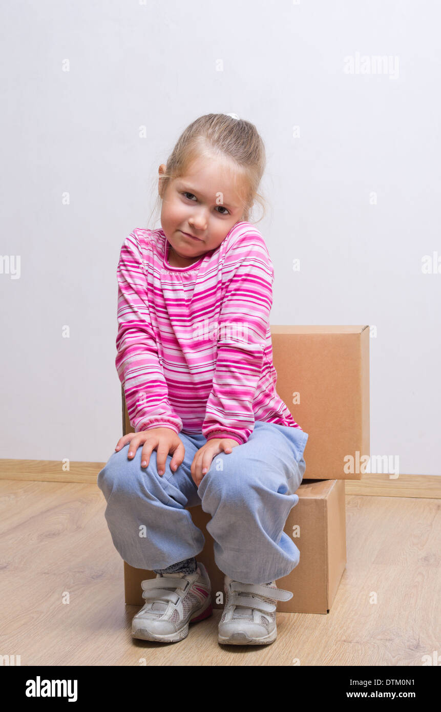 Little girl with boxes Stock Photo - Alamy