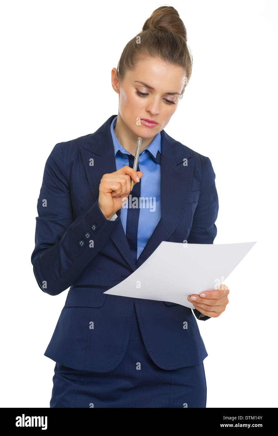 Business woman examining document Stock Photo - Alamy
