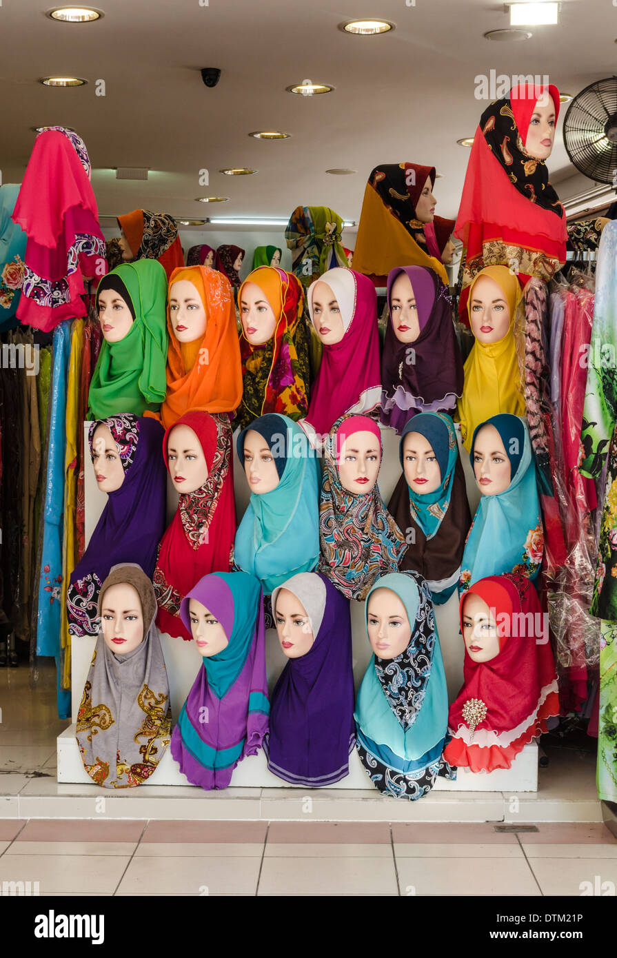 Manikin heads of women wearing the traditional Malaysian headscarf ...
