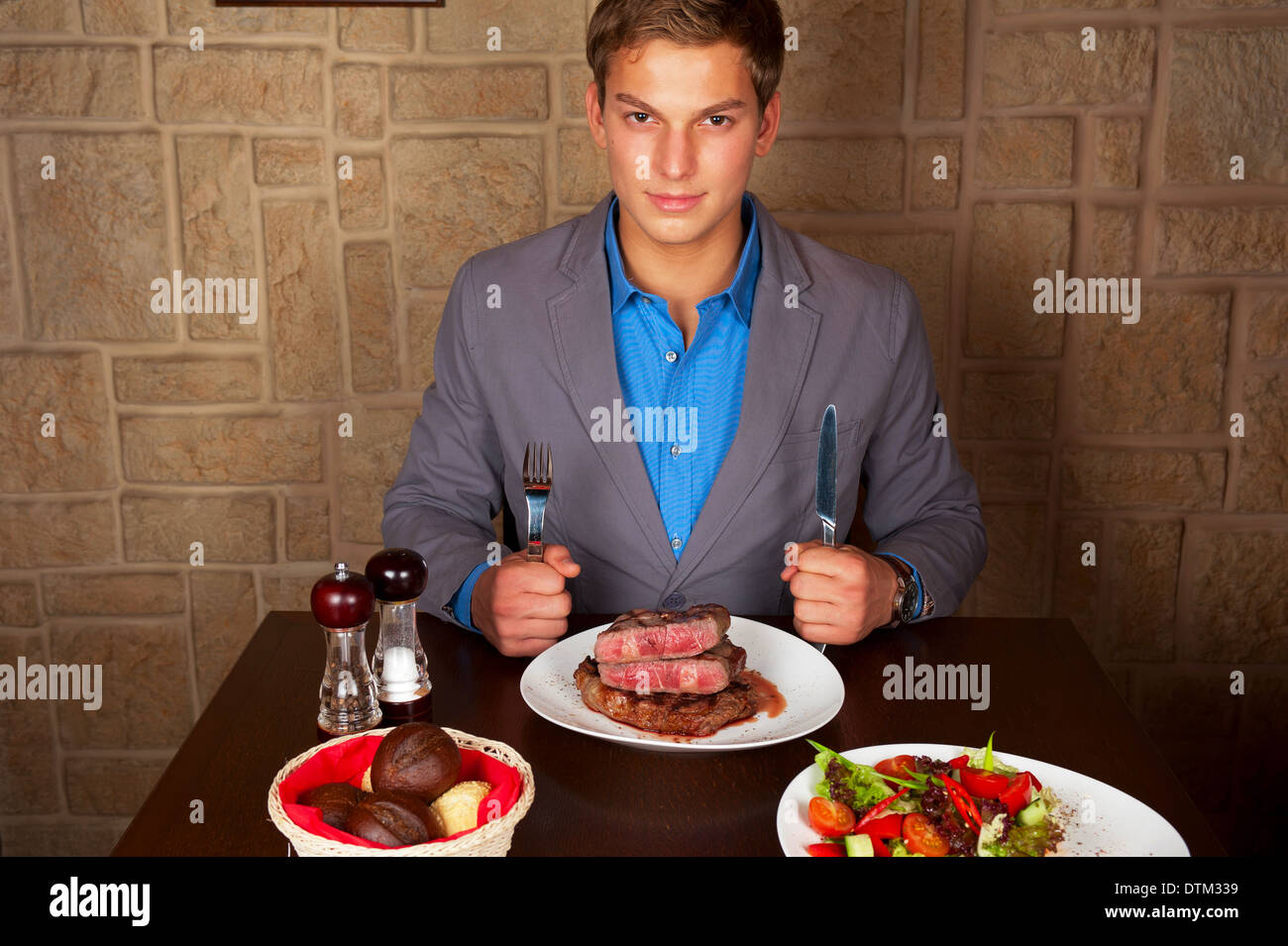 eat a beef steak Stock Photo - Alamy