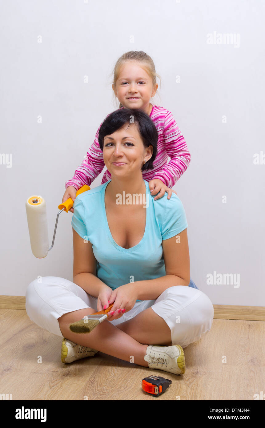 Little girl and woman with working tools Stock Photo - Alamy