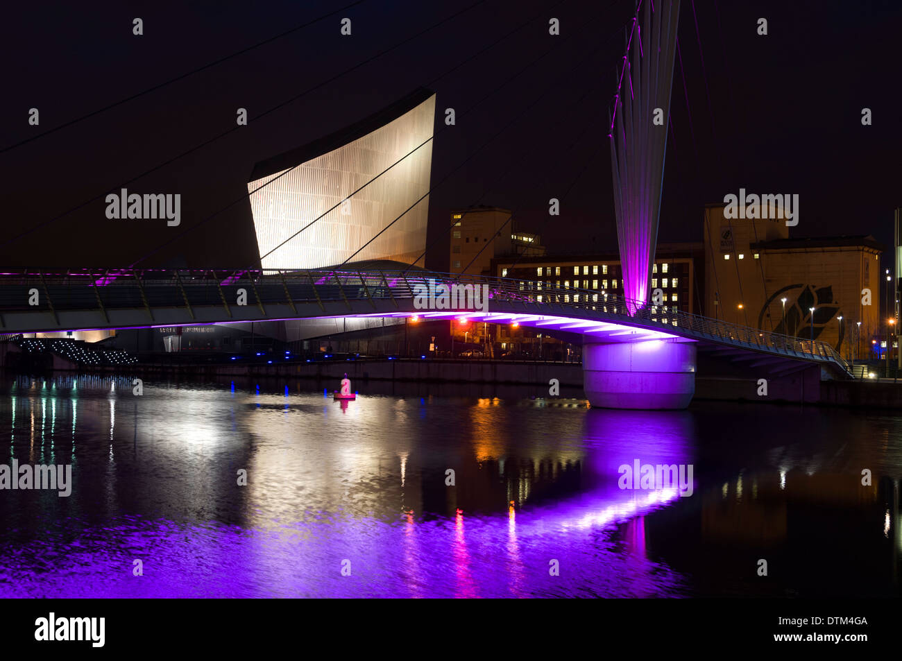Imperial War Museum North and the MediaCityUK swing footbridge at night ...