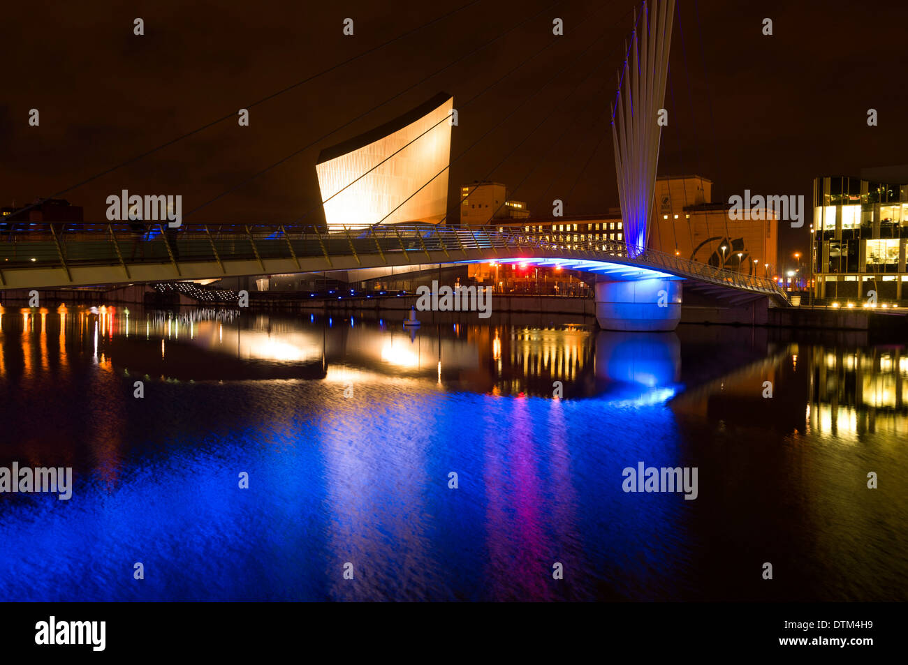 Imperial War Museum North and the MediaCityUK swing footbridge at night ...
