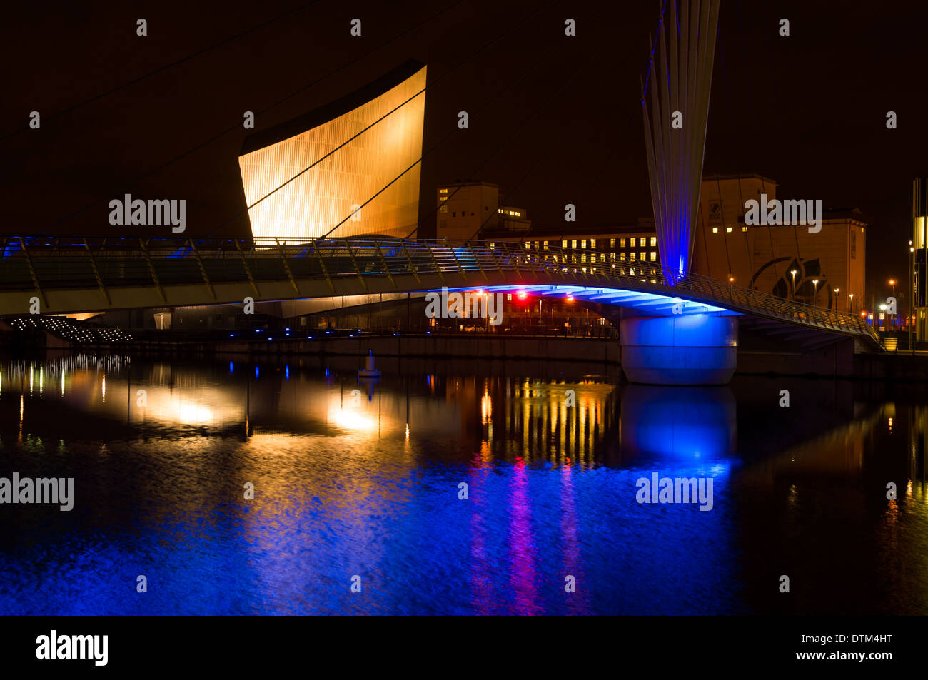 Imperial War Museum North and the MediaCityUK swing footbridge at night ...