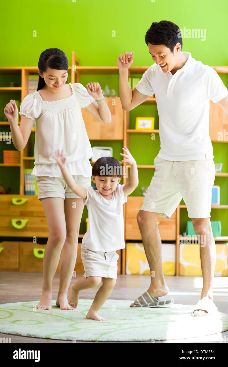 Happy family dancing Stock Photo - Alamy