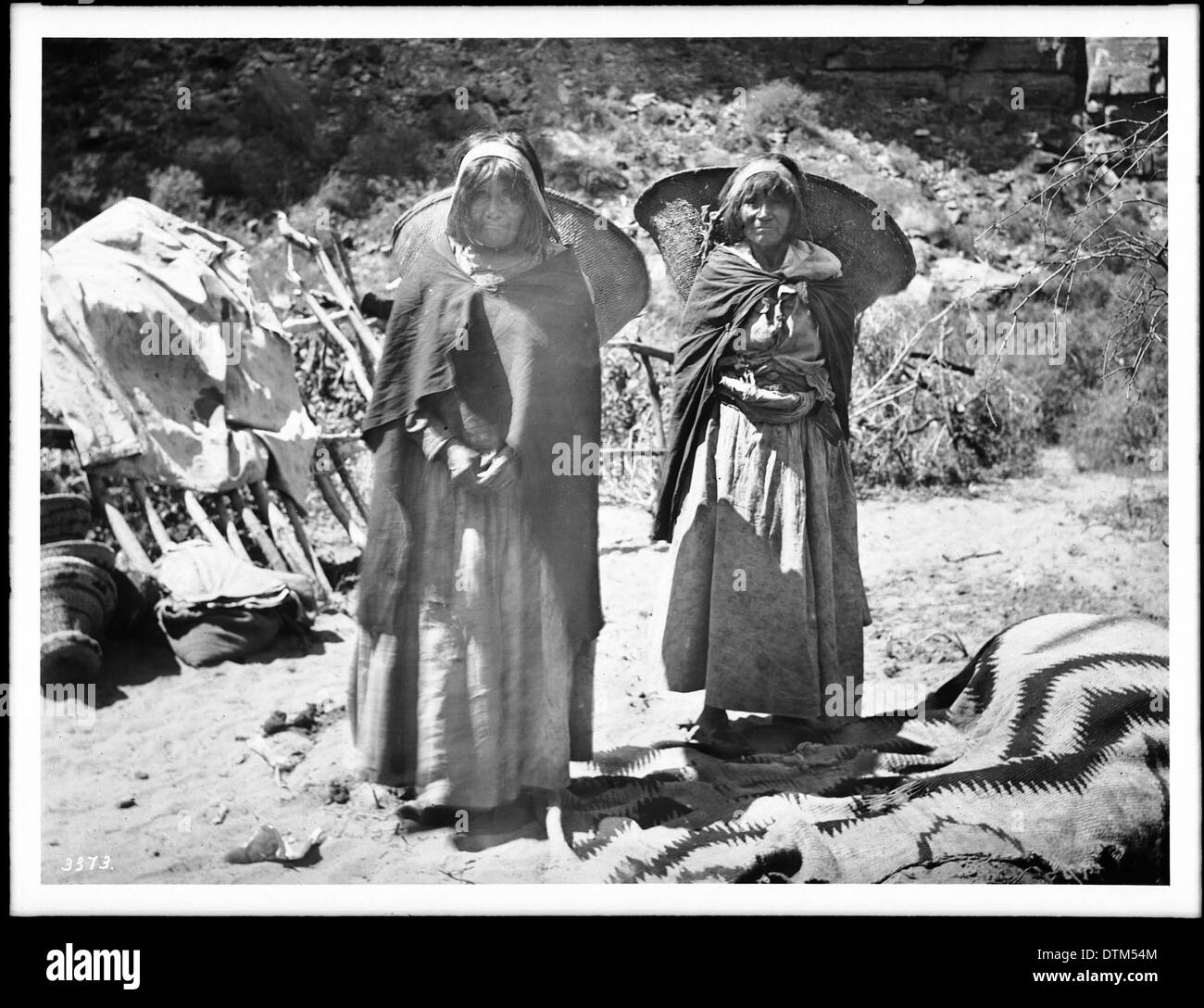 Two Havasupai Indian women carrying 'Kathaks' (woven baskets) on their ...