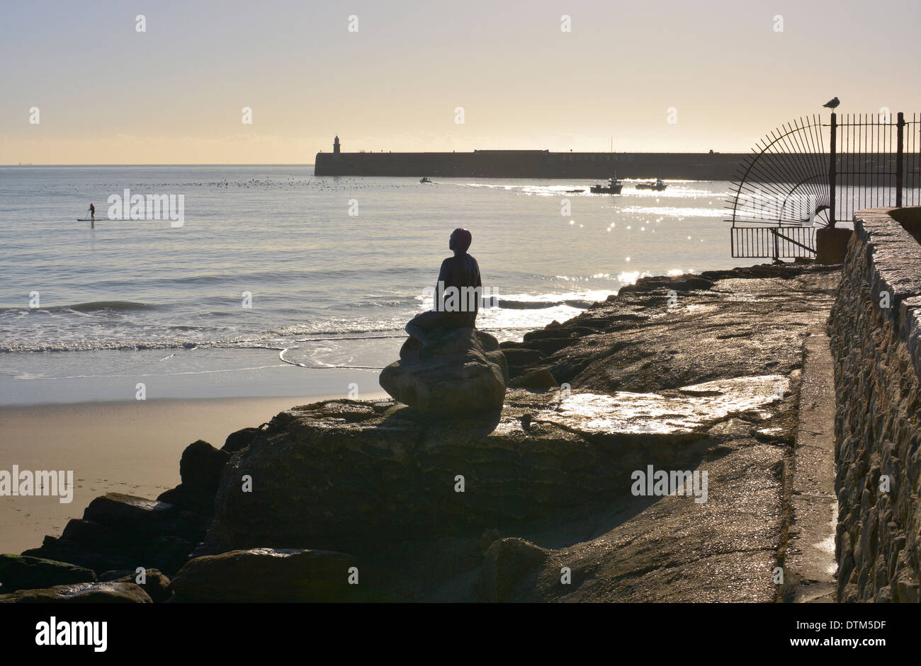 Harbour with sculpture in silhouette. Folkestone in Kent. England Stock ...