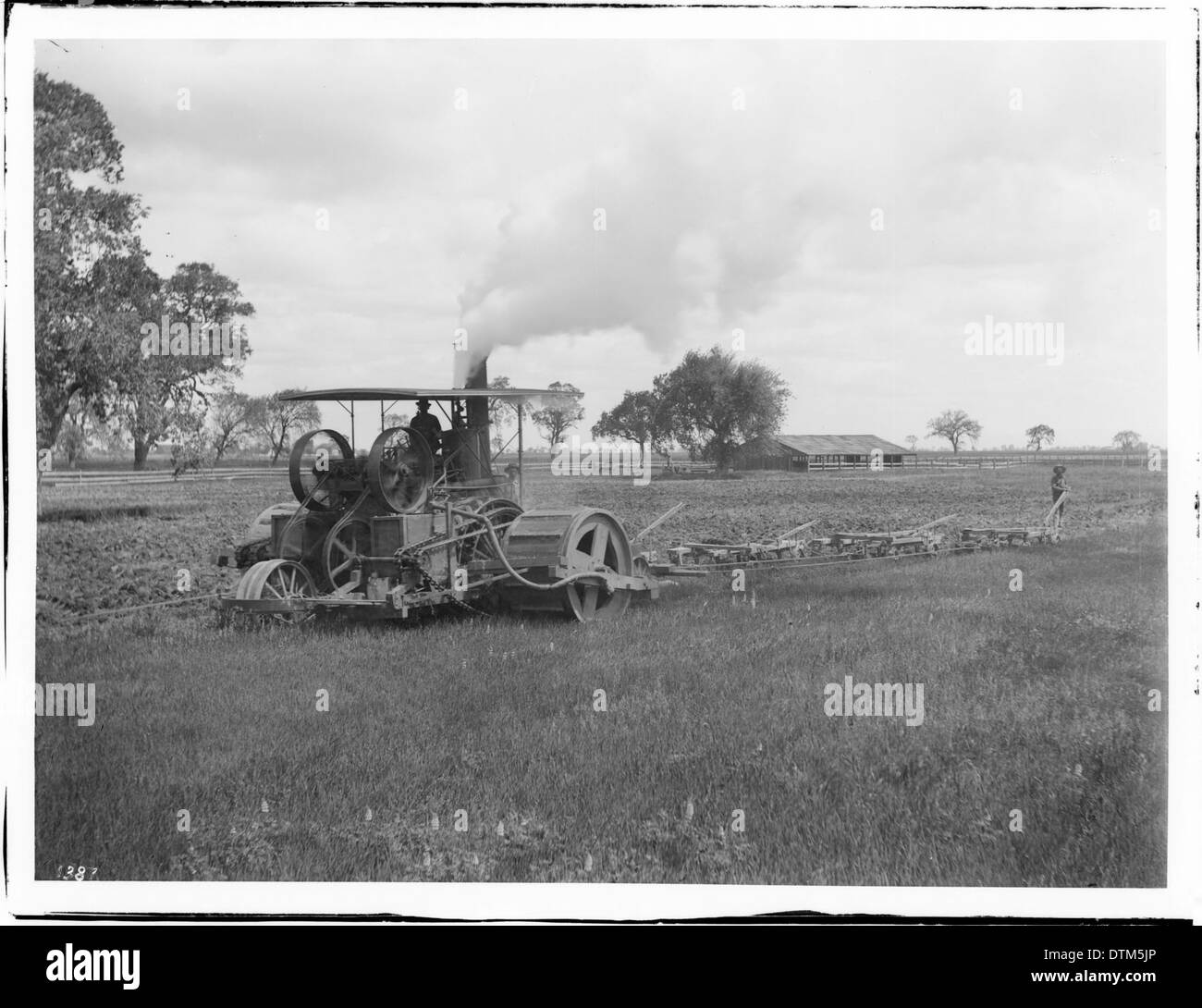 Two men are seen operating a steam plow in a field near Hanford, Kings ...