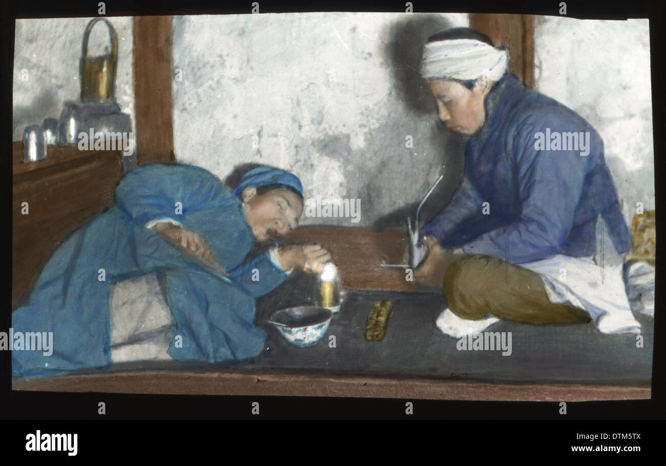 A photograph showing two people smoking opium indoors in China ...