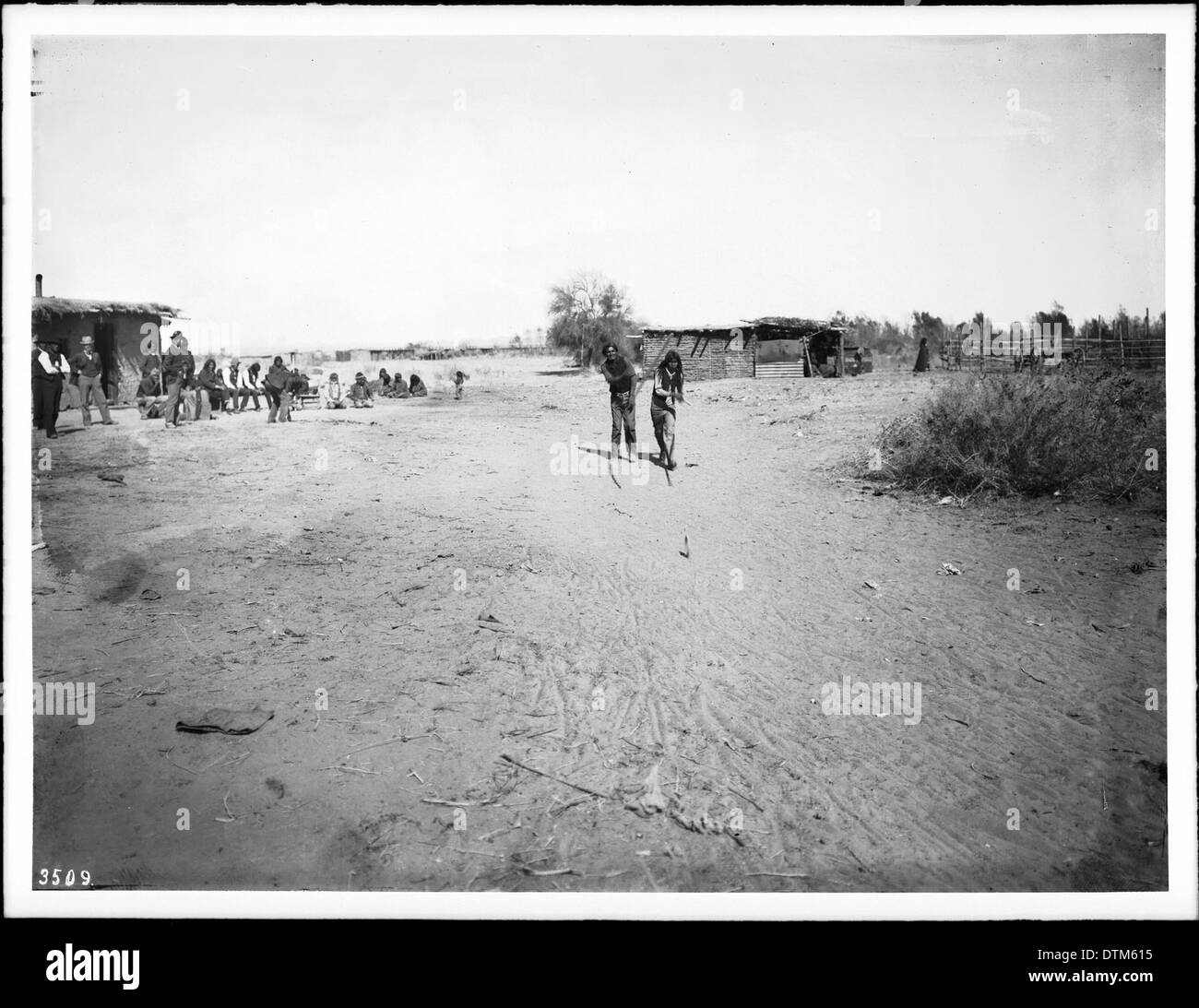 Two young Yuma Indian men playing the pole and hoop game, photographed ...
