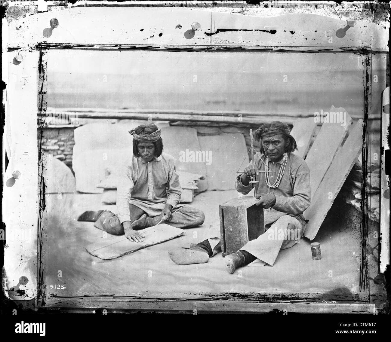 Two Zuni Indian men making wampum, ca.1900 Stock Photo - Alamy