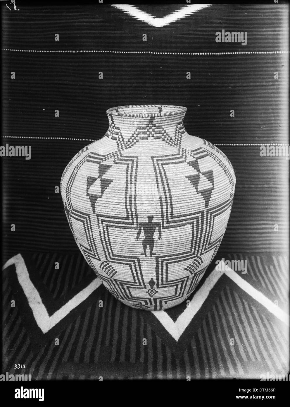 A photograph of an unidentified Native American basket displayed for ...