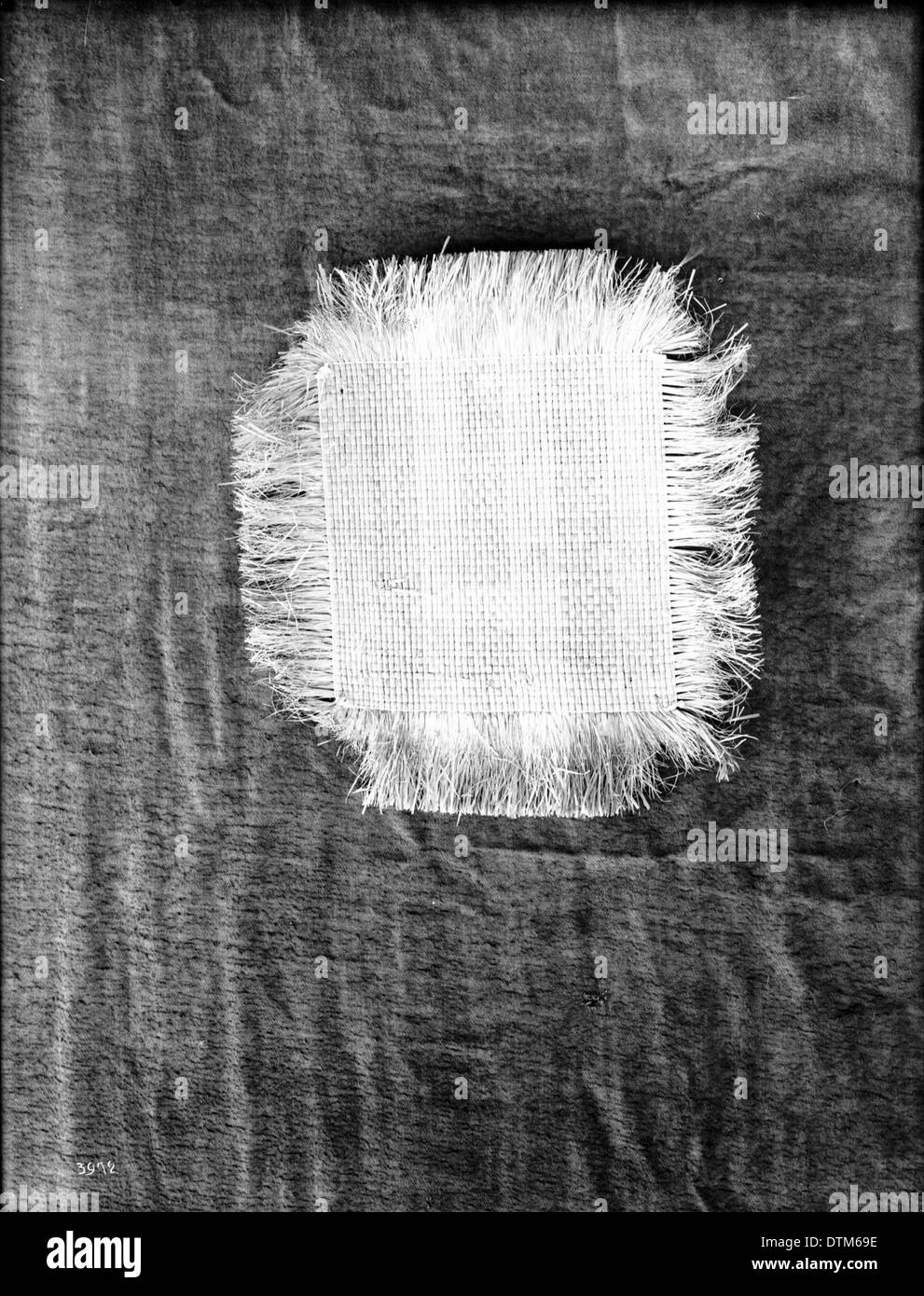 An unidentified Indian mat is displayed in a vintage photograph from ...