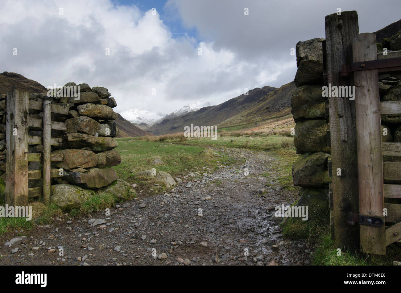 A field gate in a dry stone wall in Eskdale, Lake District, England ...