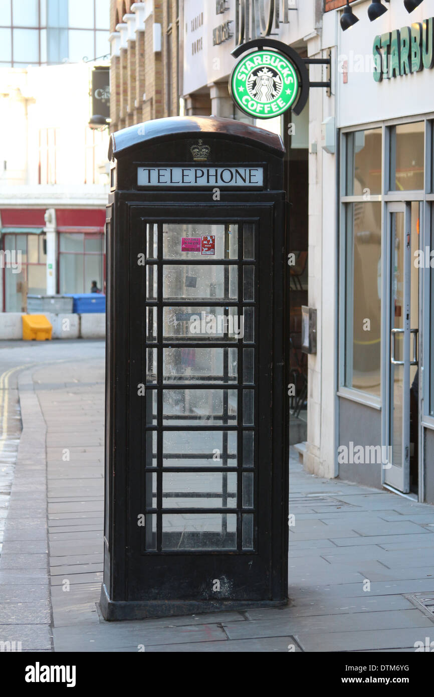 A Black public telephone box in Clerkenwell Stock Photo - Alamy