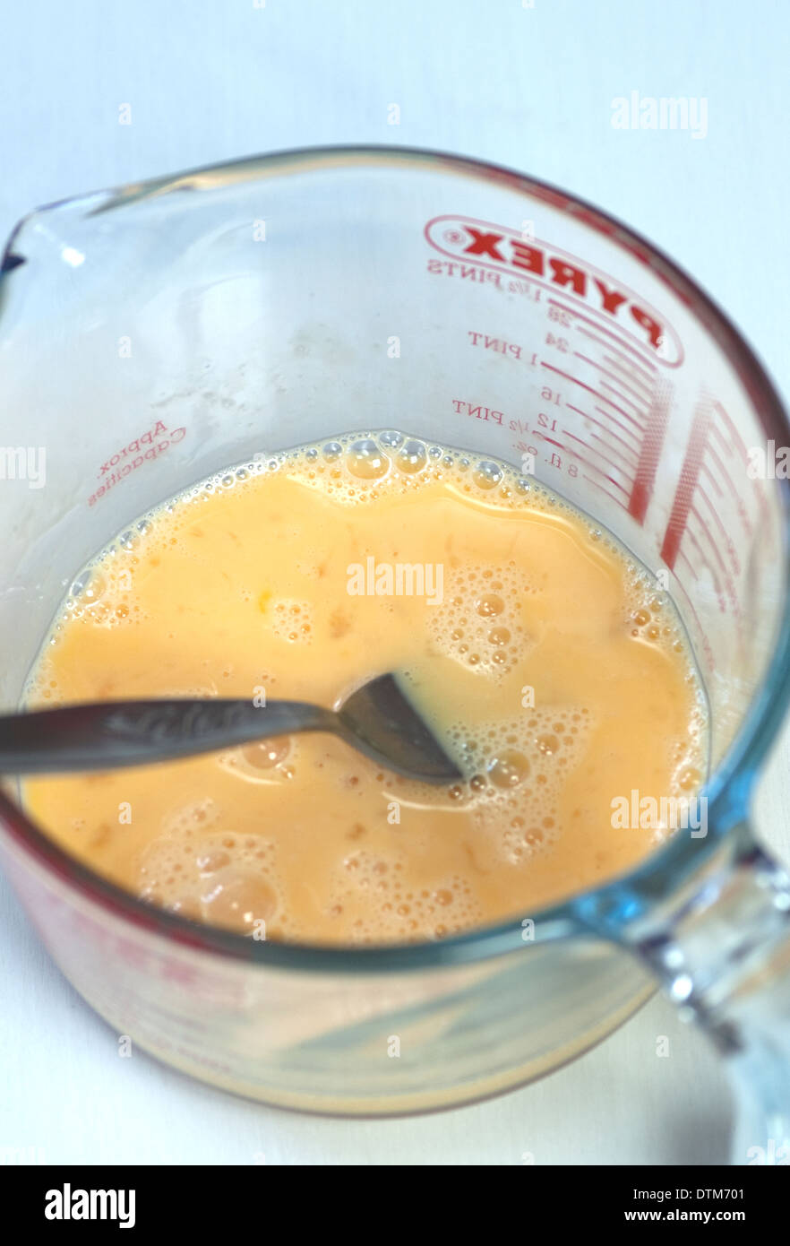 Still life food image of a glass Pyrex jug containing beaten eggs Stock ...