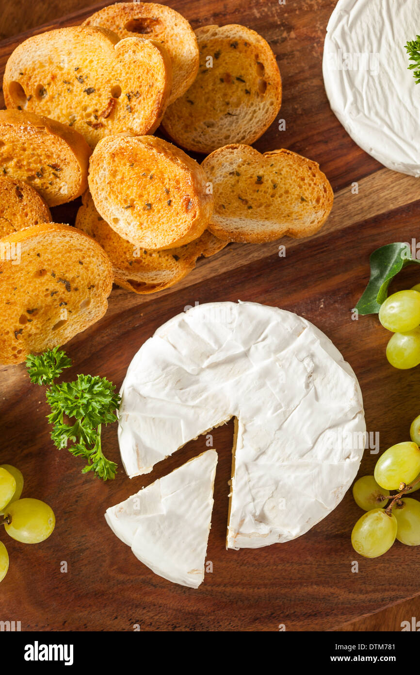 Organic Homemade White Brie Cheese with Bread and Grapes Stock Photo ...