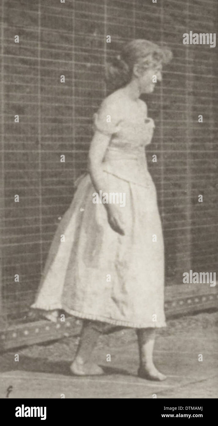 A woman in a long dress is photographed curtsying, kissing her hand ...