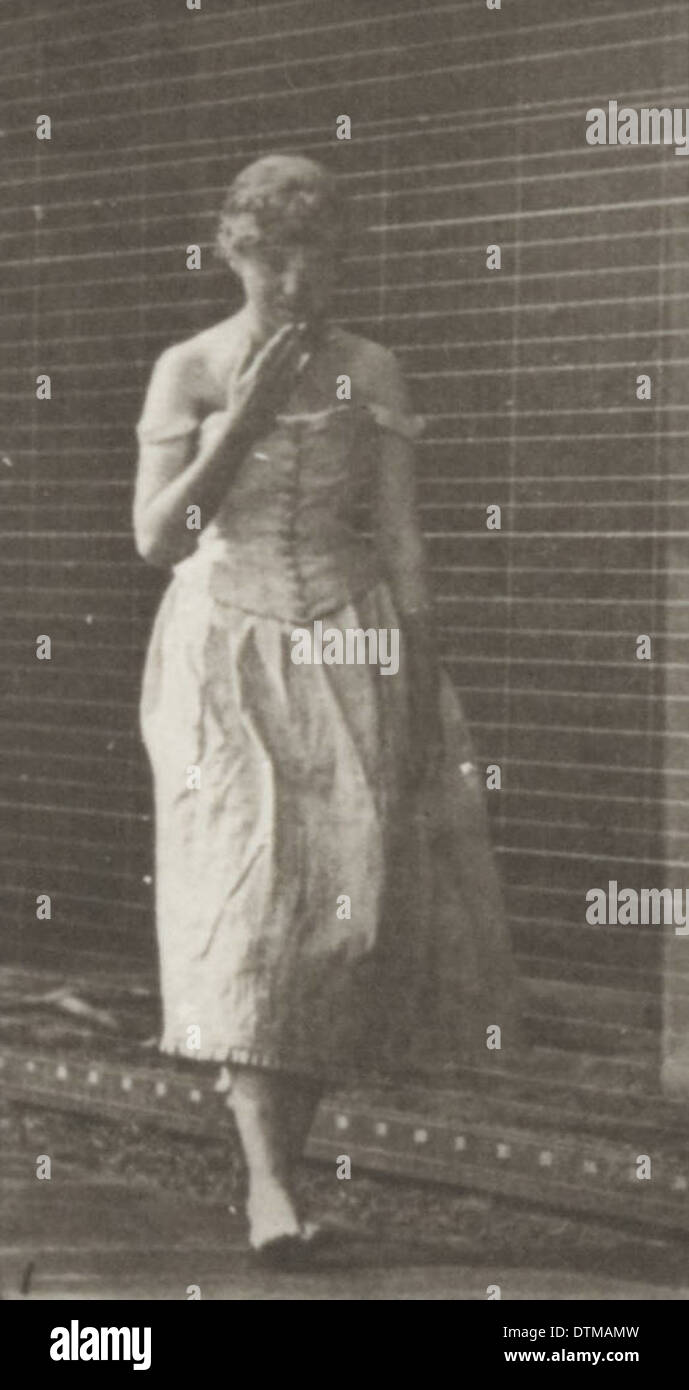 A photograph of a woman in a long dress curtseying, kissing her hand ...