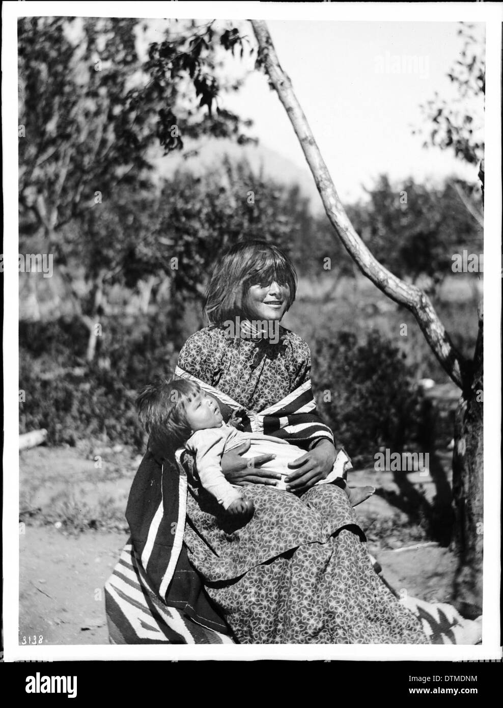 Young Walapai Indian mother with child in her arms, Hackbury, Arizona ...