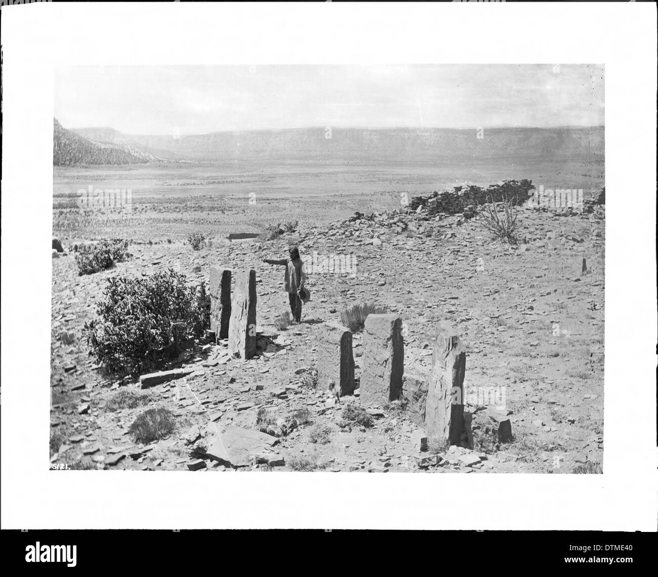 A photograph of a Zuni Indian man performing a religious worship ...