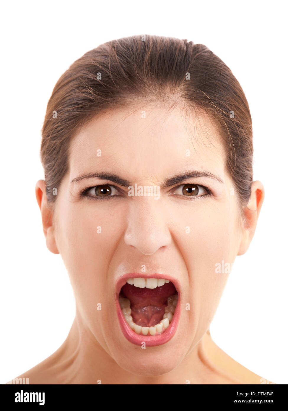 Close-up portrait of a angry woman shouting, over a white background ...