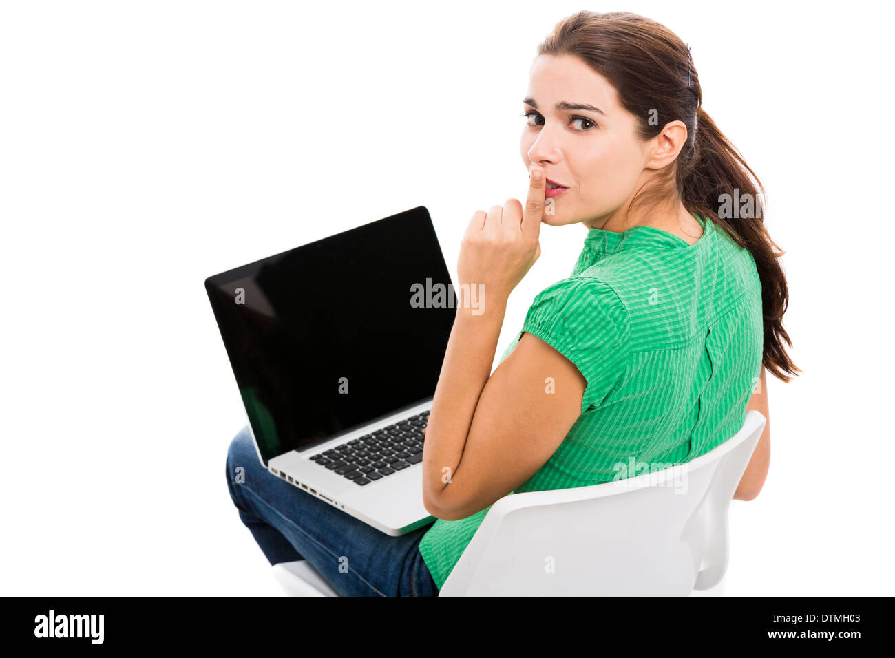 Beautiful female student sitting on a chair with a laptop, isolated ...