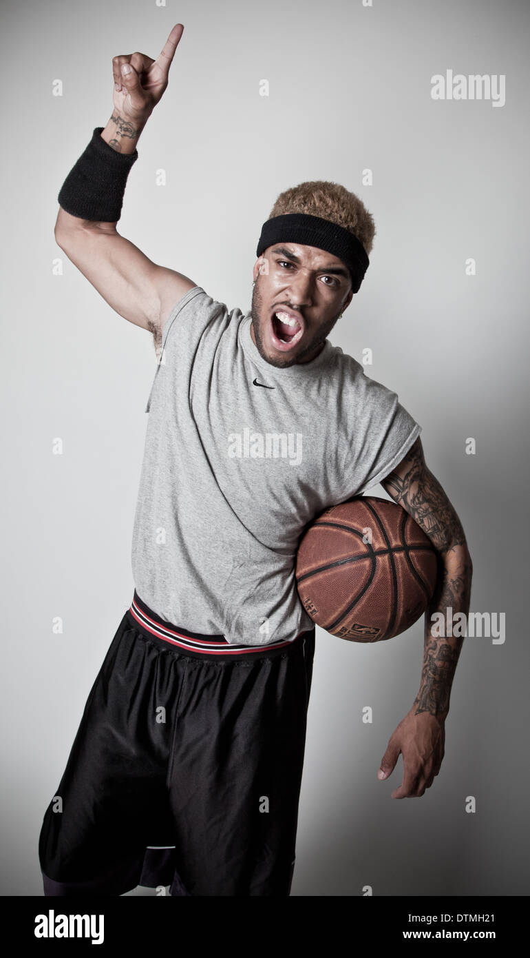 black male in studio with a basketball showing us who's number one in ...