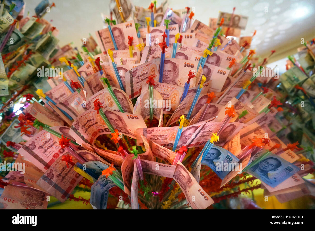 Money tree full of Thai banknotes at a buddhist temple. Donations are ...