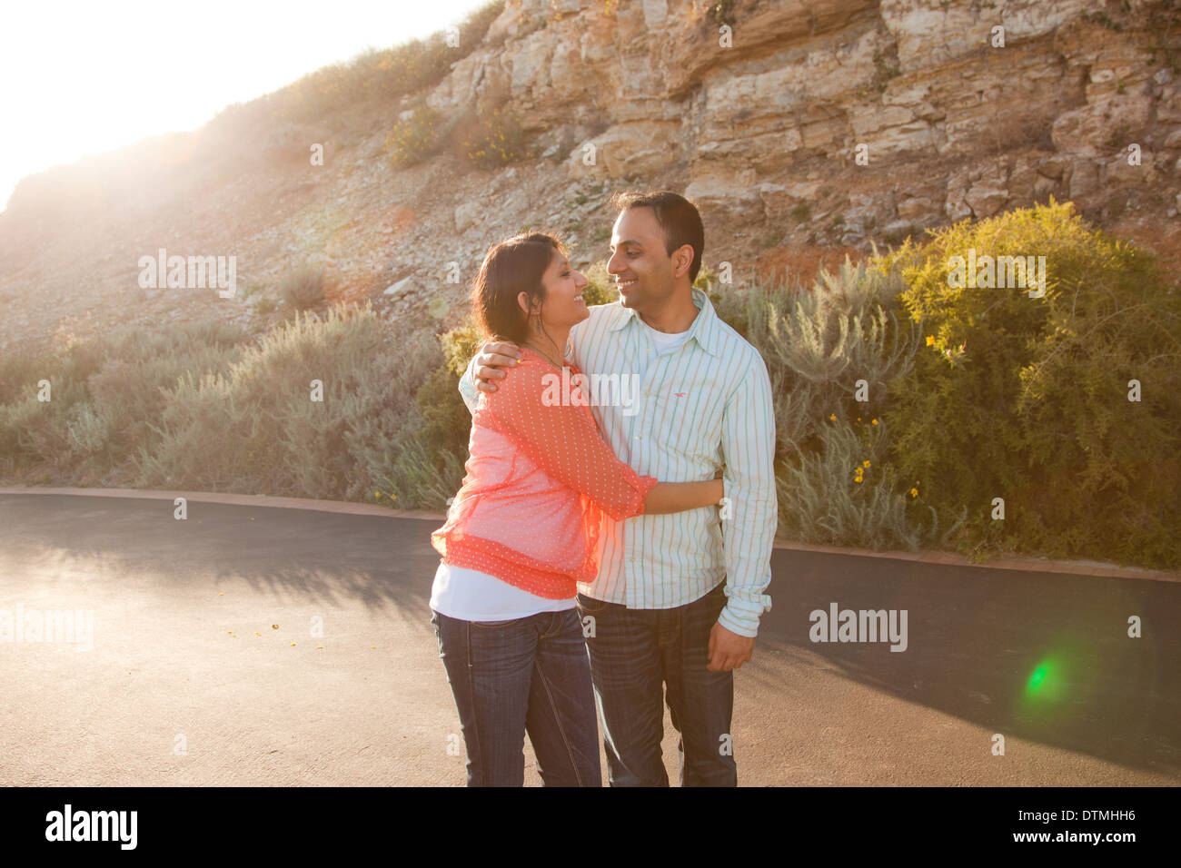 indian couple hug and smile and love each other mountain side Stock ...