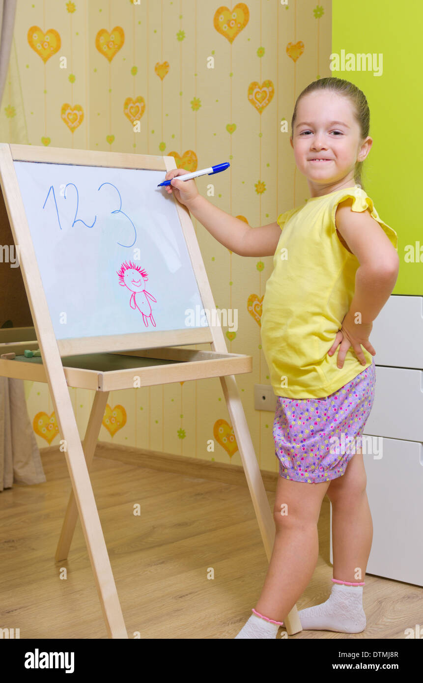Little girl studies at home Stock Photo - Alamy