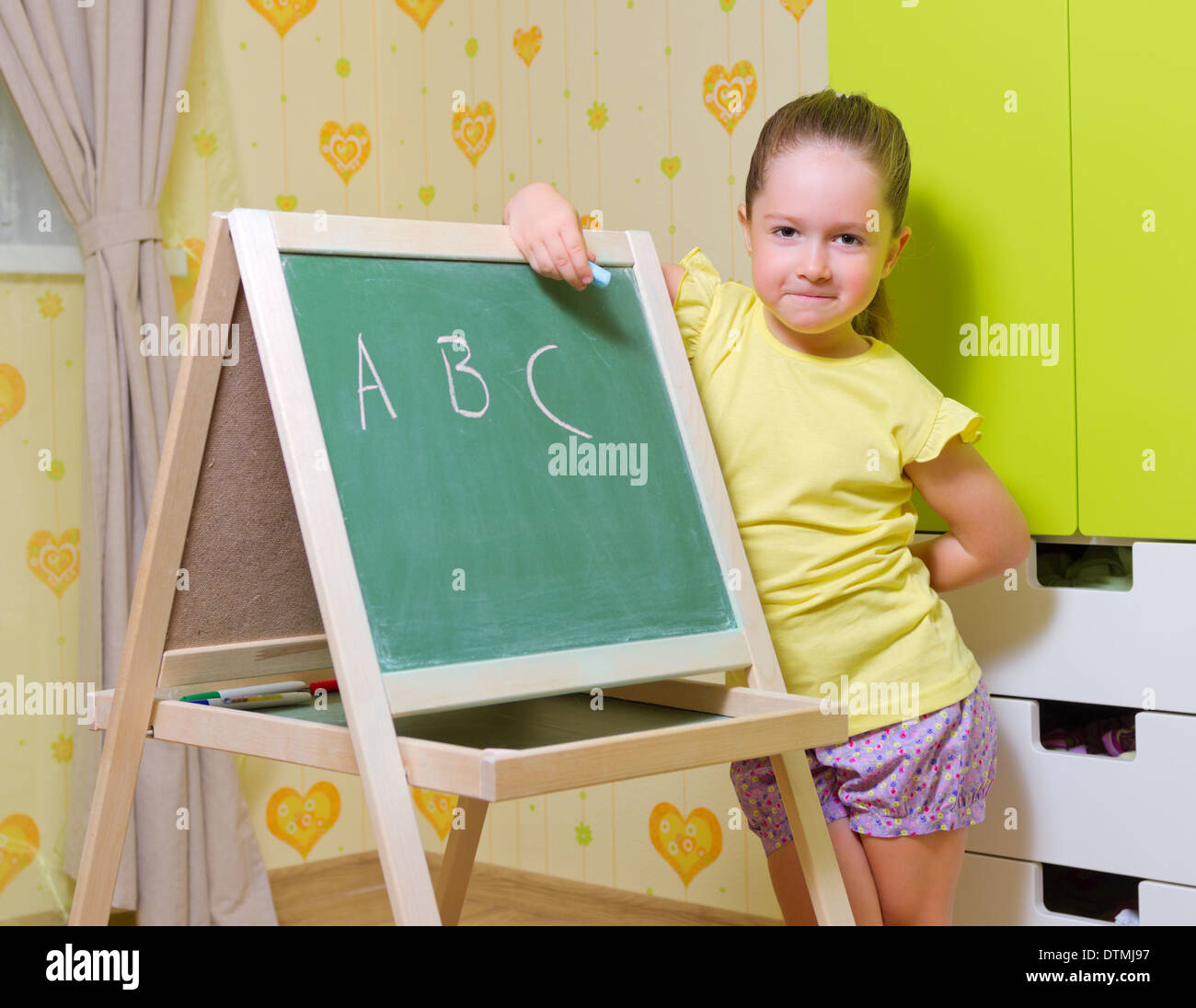 Little girl studies at home Stock Photo - Alamy