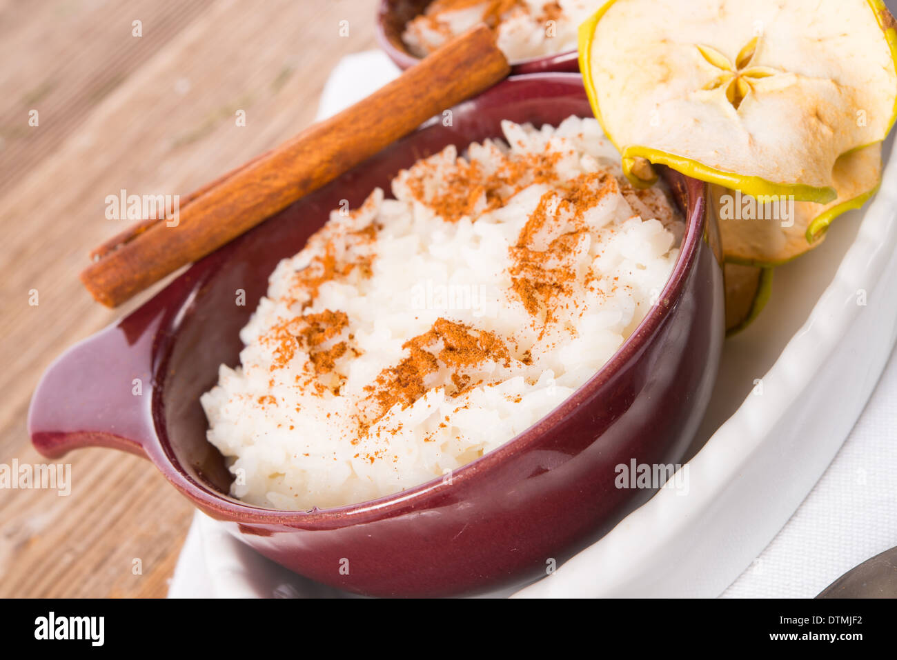 milk rice with cinnamon and applesauce Stock Photo - Alamy