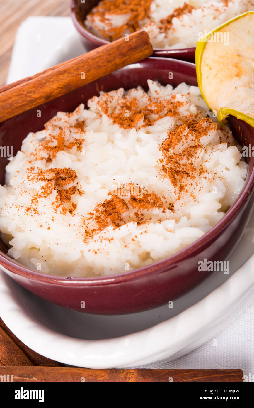 milk rice with cinnamon and applesauce Stock Photo - Alamy