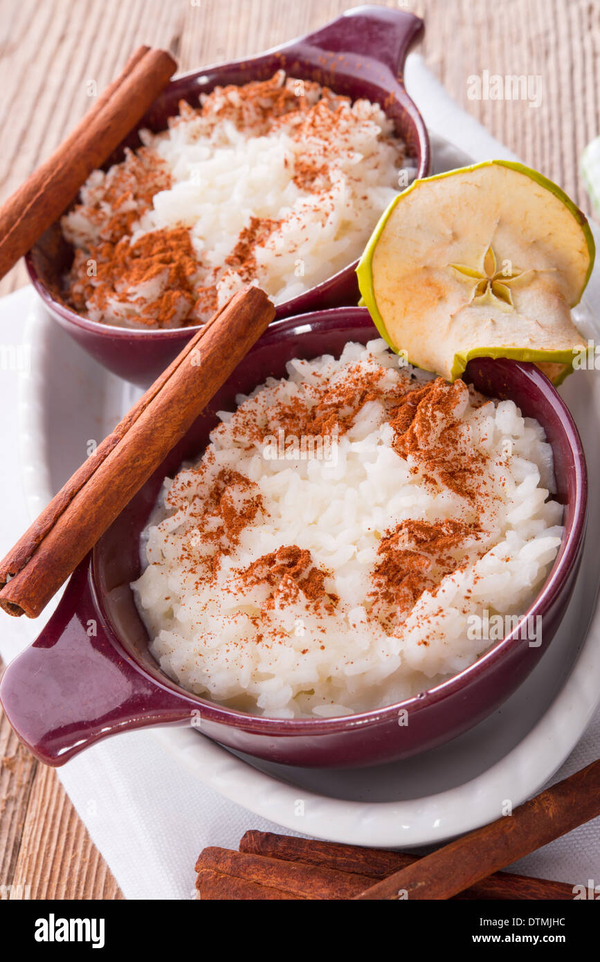 milk rice with cinnamon and applesauce Stock Photo - Alamy