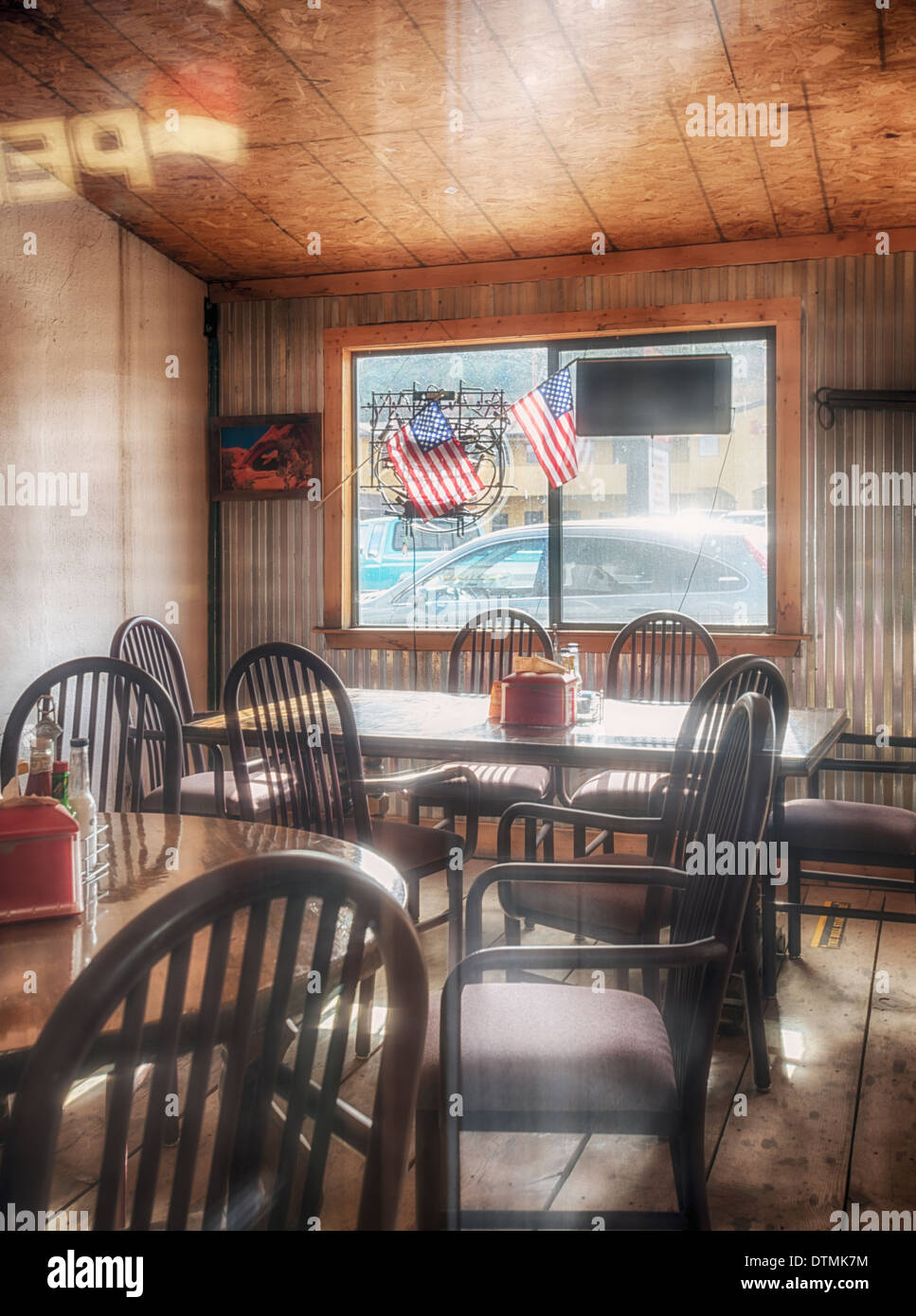 A classic American cafe with flags reflecting in the windows Stock ...