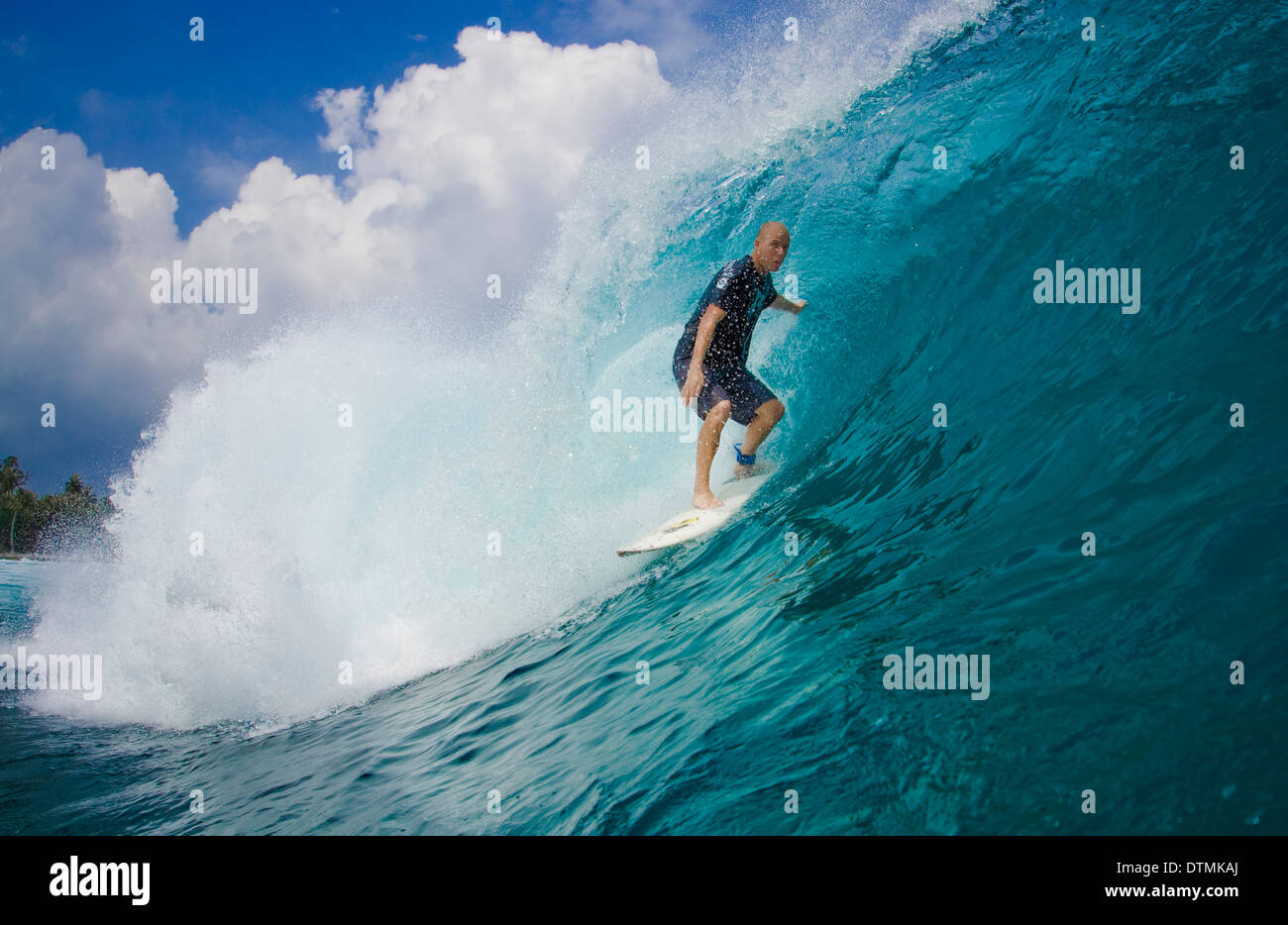 surfer on a surfboard riding a wave in the ocean sea water wave beach ...