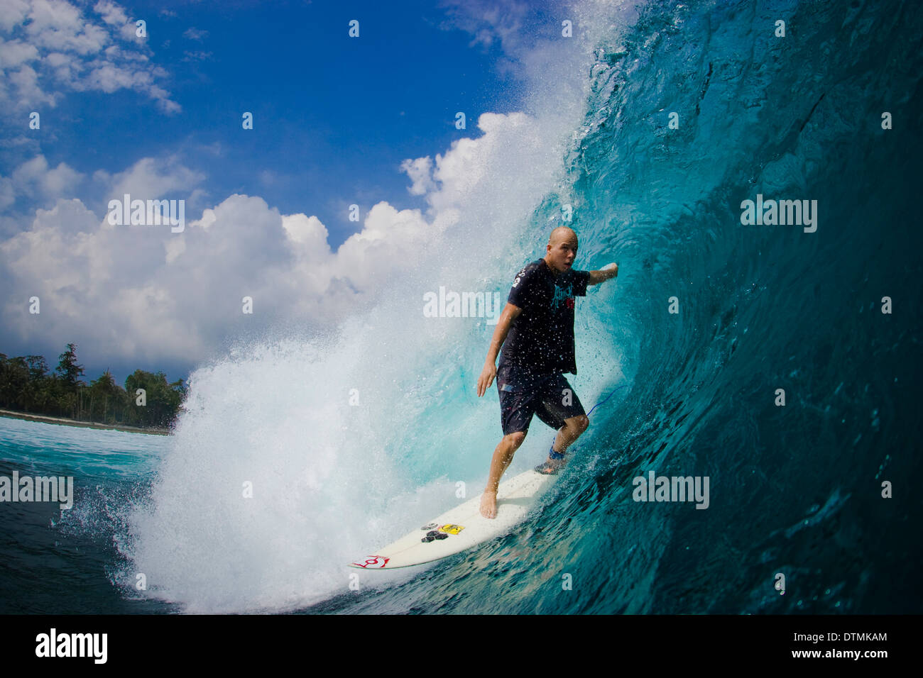 surfer on a surfboard riding a wave in the ocean sea water wave beach ...