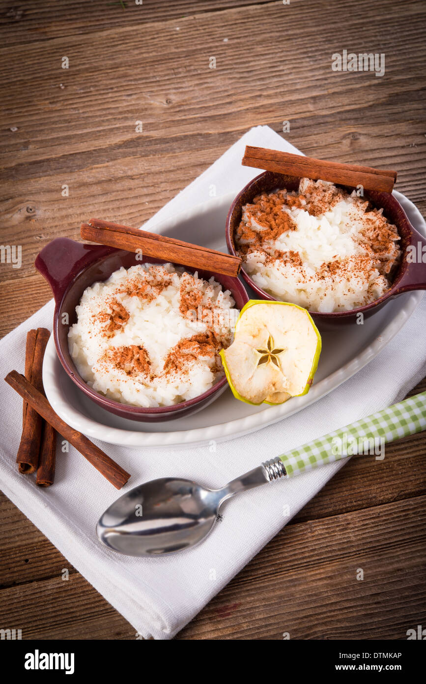 milk rice with cinnamon and applesauce Stock Photo - Alamy