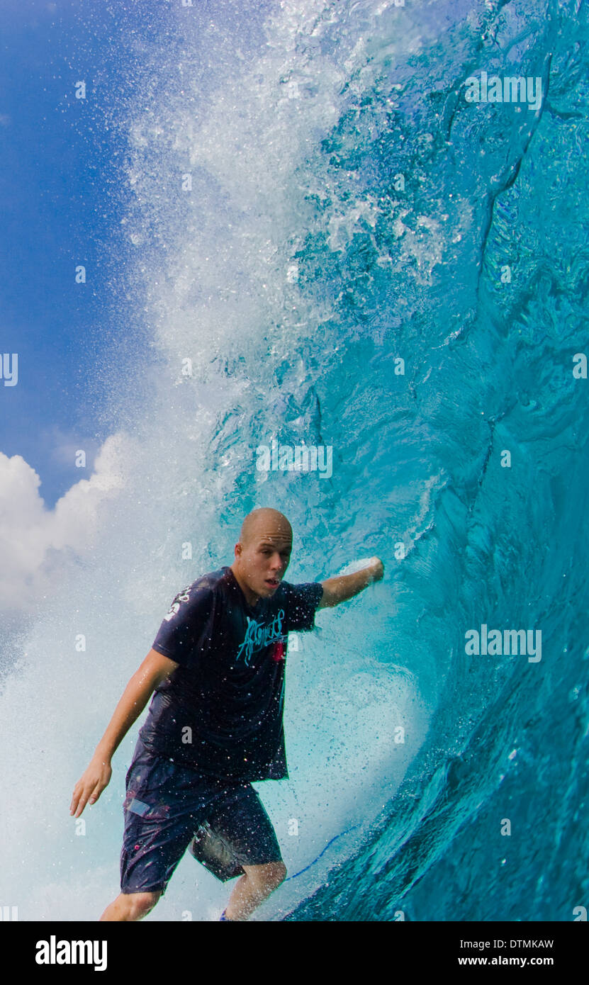surfer on a surfboard riding a wave in the ocean sea water wave beach ...