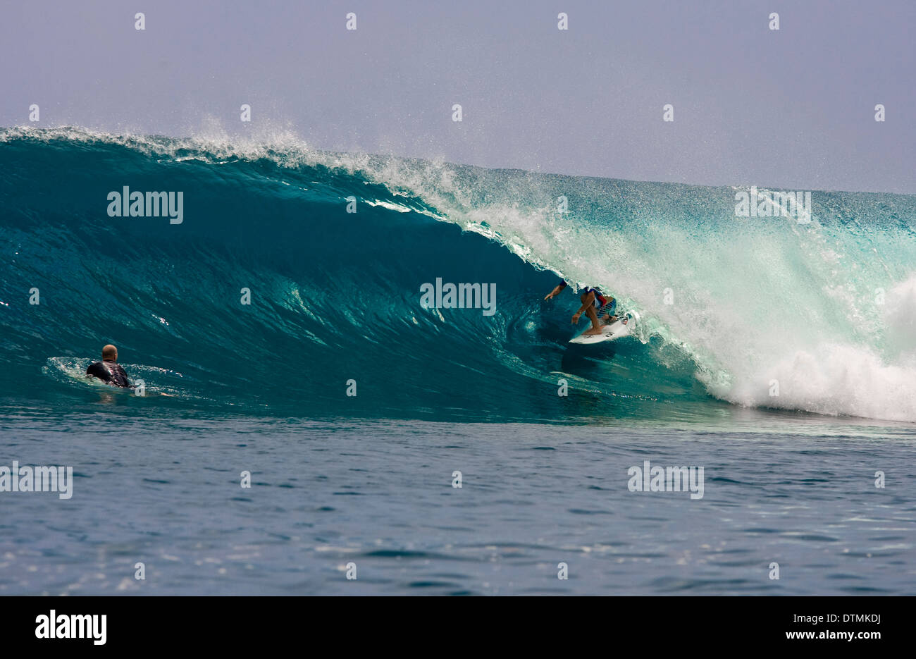 surfer on a surfboard riding a wave in the ocean sea water wave beach ...