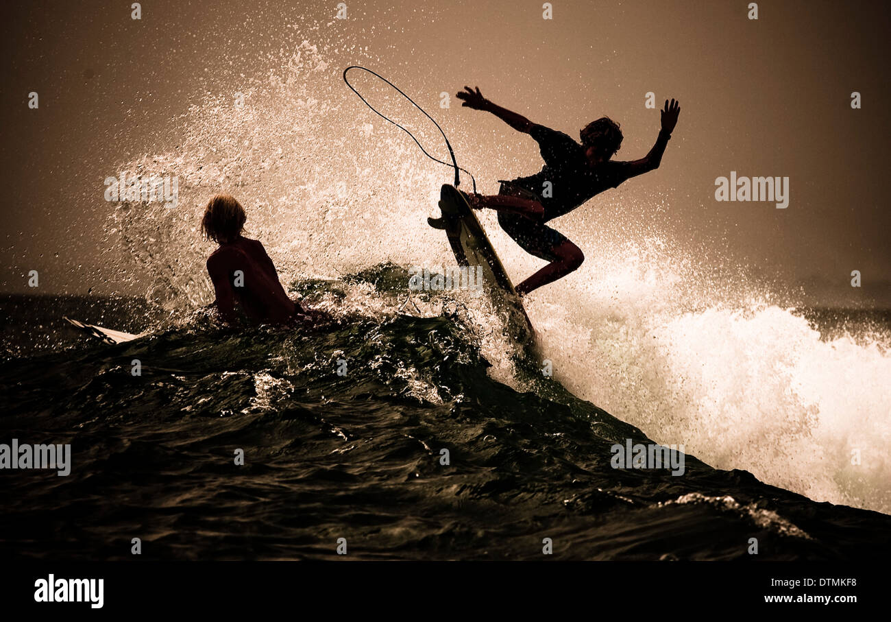surfer on a surfboard riding a wave in the ocean sea water wave beach ...
