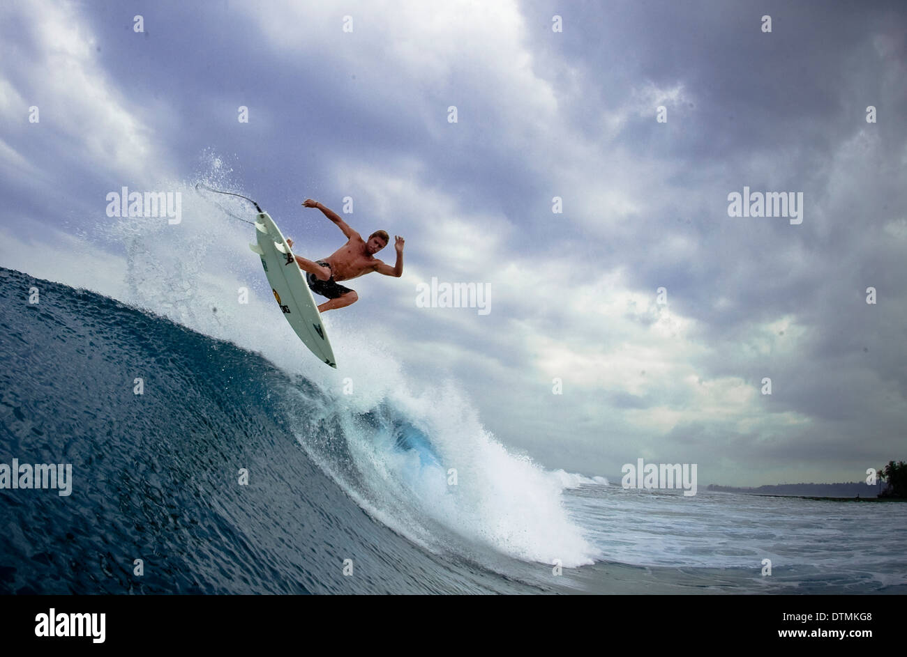 surfer on a surfboard riding a wave in the ocean sea water wave beach ...