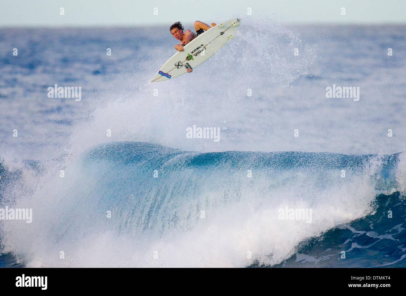 surfer on a surfboard riding a wave in the ocean sea water wave beach ...