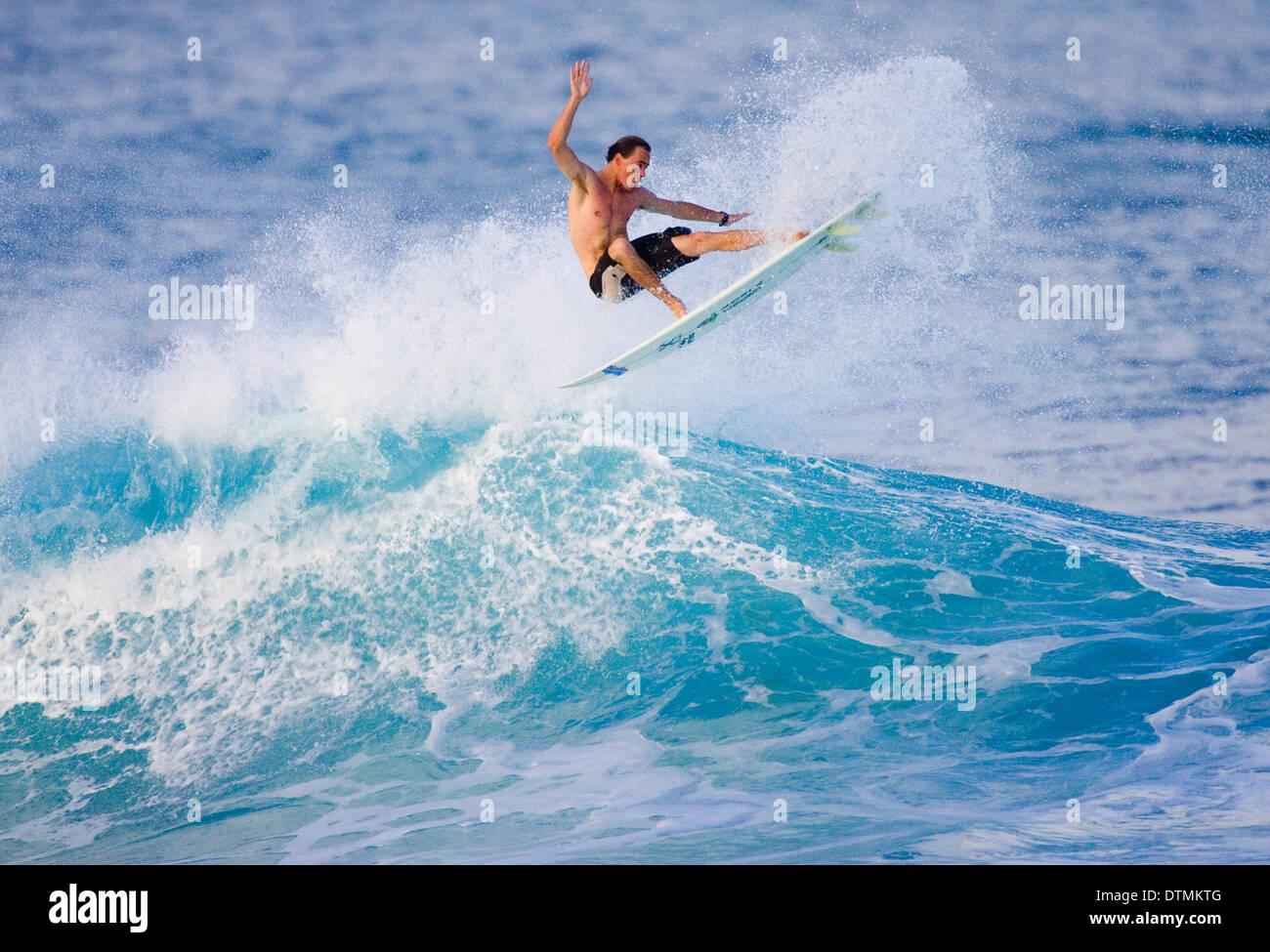 surfer on a surfboard riding a wave in the ocean sea water wave beach ...