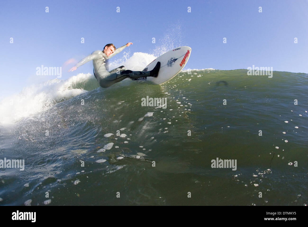 surfer on a surfboard riding a wave in the ocean sea water wave beach ...