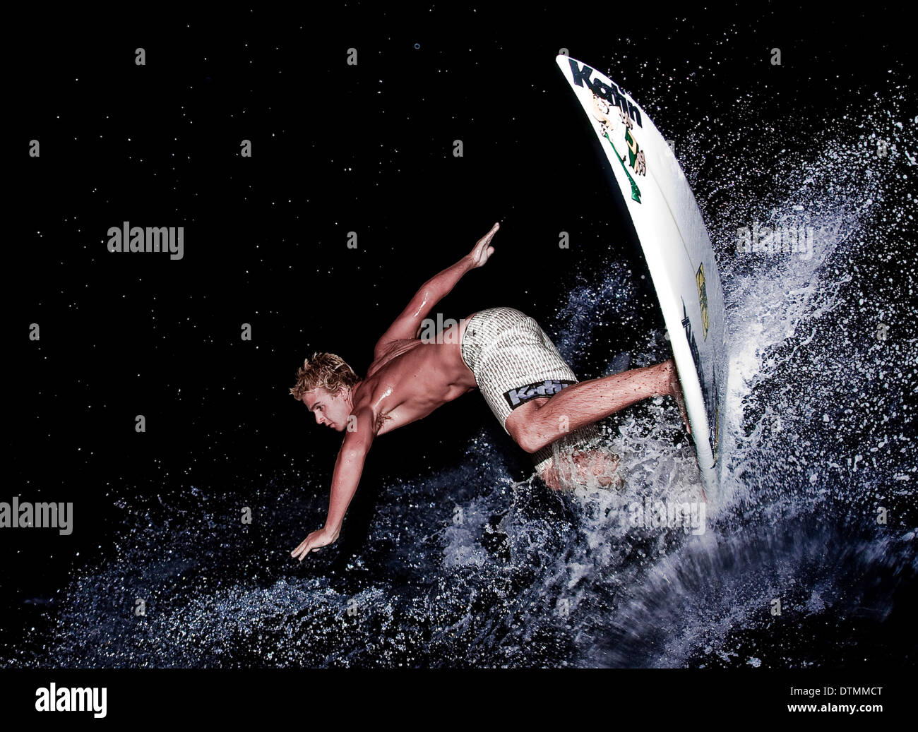 surfer on a surfboard riding a wave in the ocean sea water wave beach ...