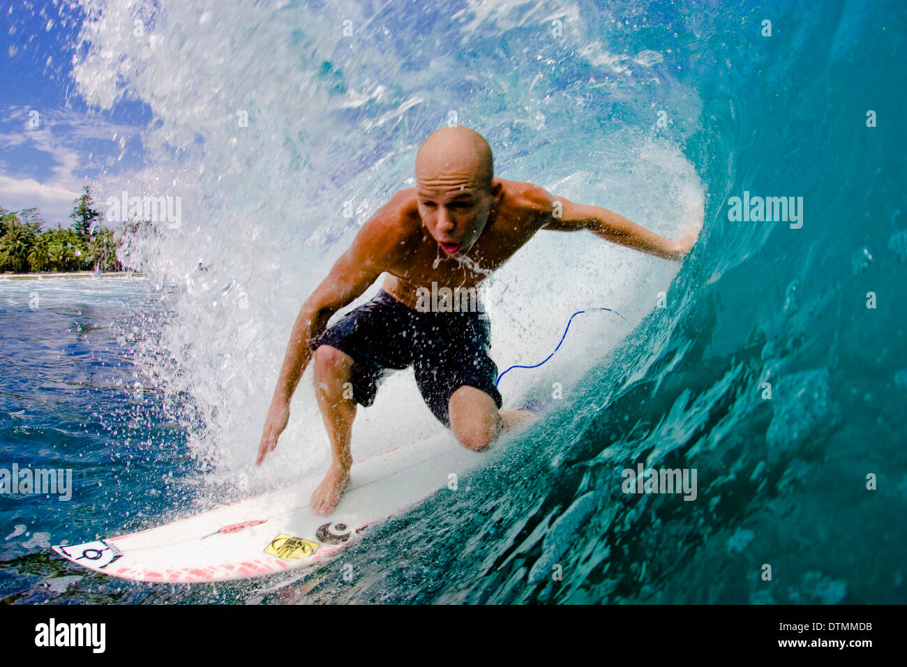 surfer on a surfboard riding a wave in the ocean sea water wave beach ...