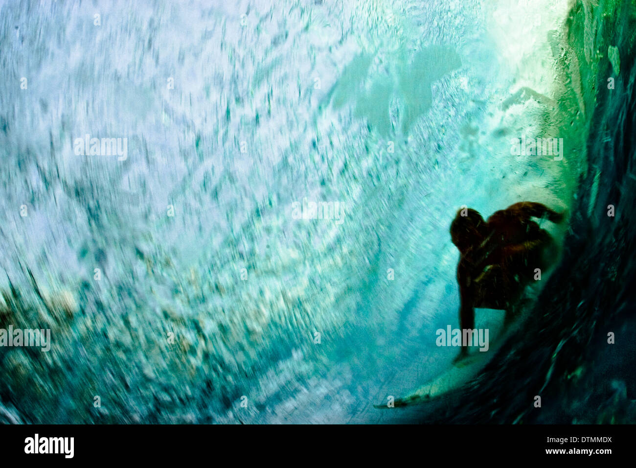 surfer on a surfboard riding a wave in the ocean sea water wave beach ...