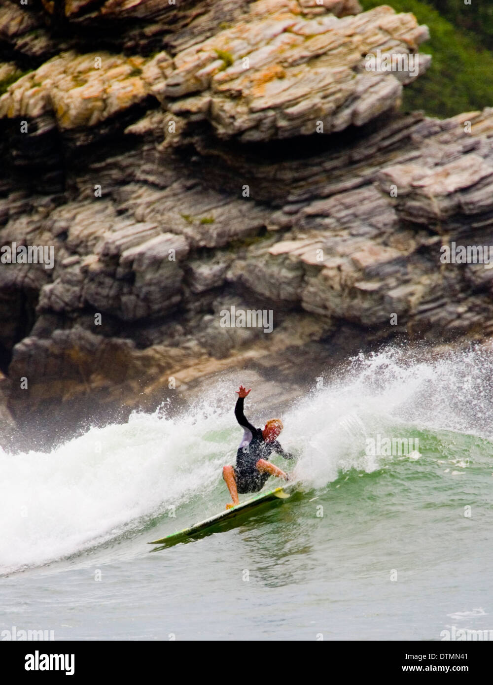 surfer on a surfboard riding a wave in the ocean sea water wave beach ...